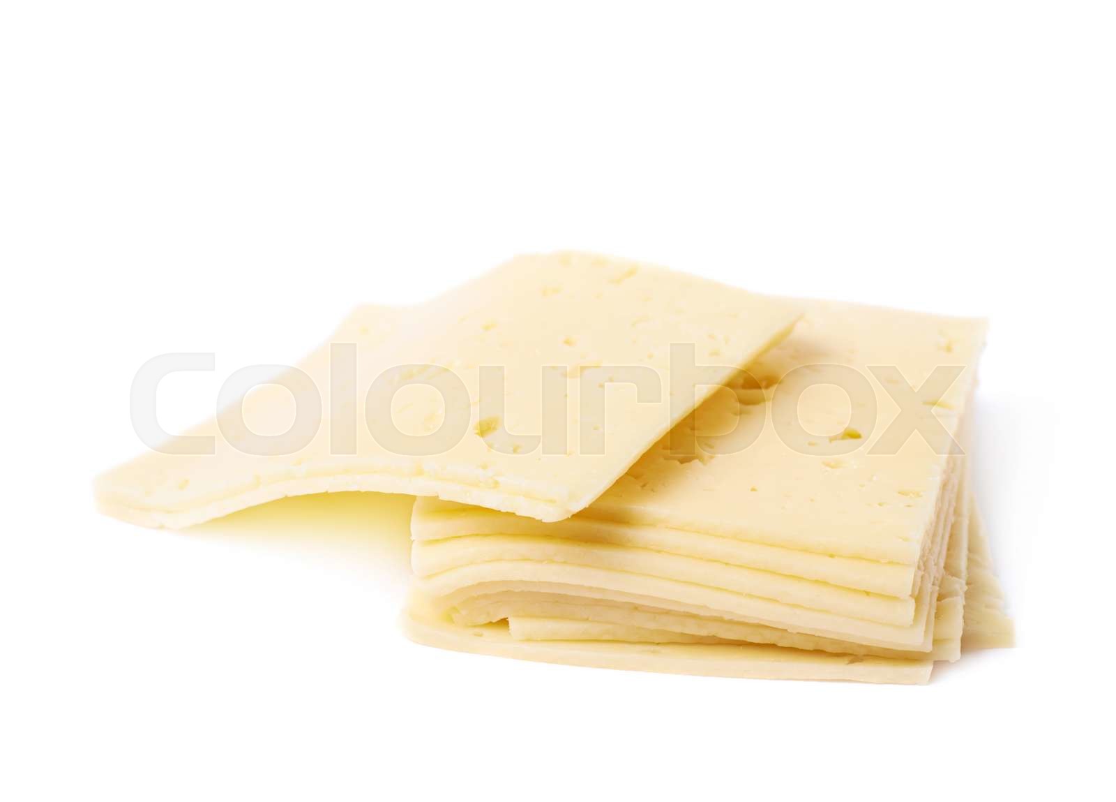 Pile of cheese slices isolated | Stock image | Colourbox