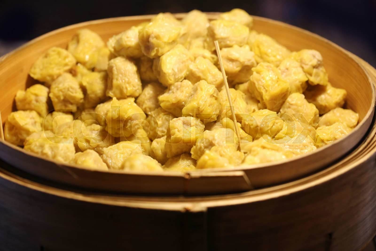 yellow dim sum with bamboo basket | Stock image | Colourbox