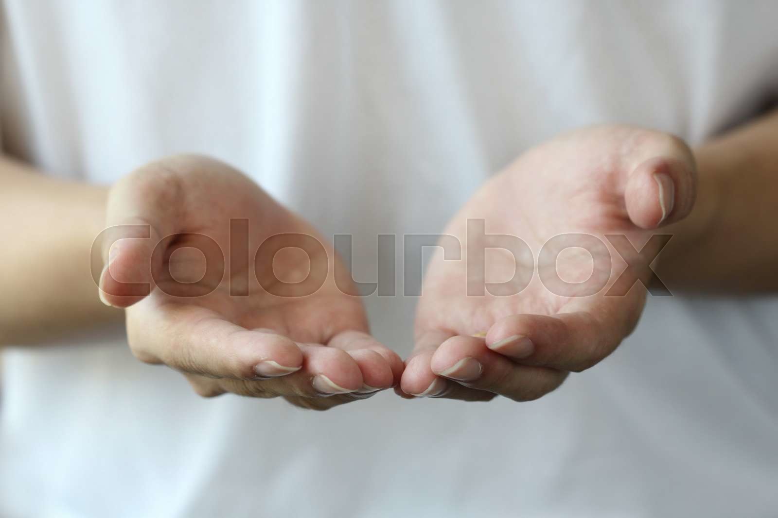 reaching cupped hands | Stock image | Colourbox