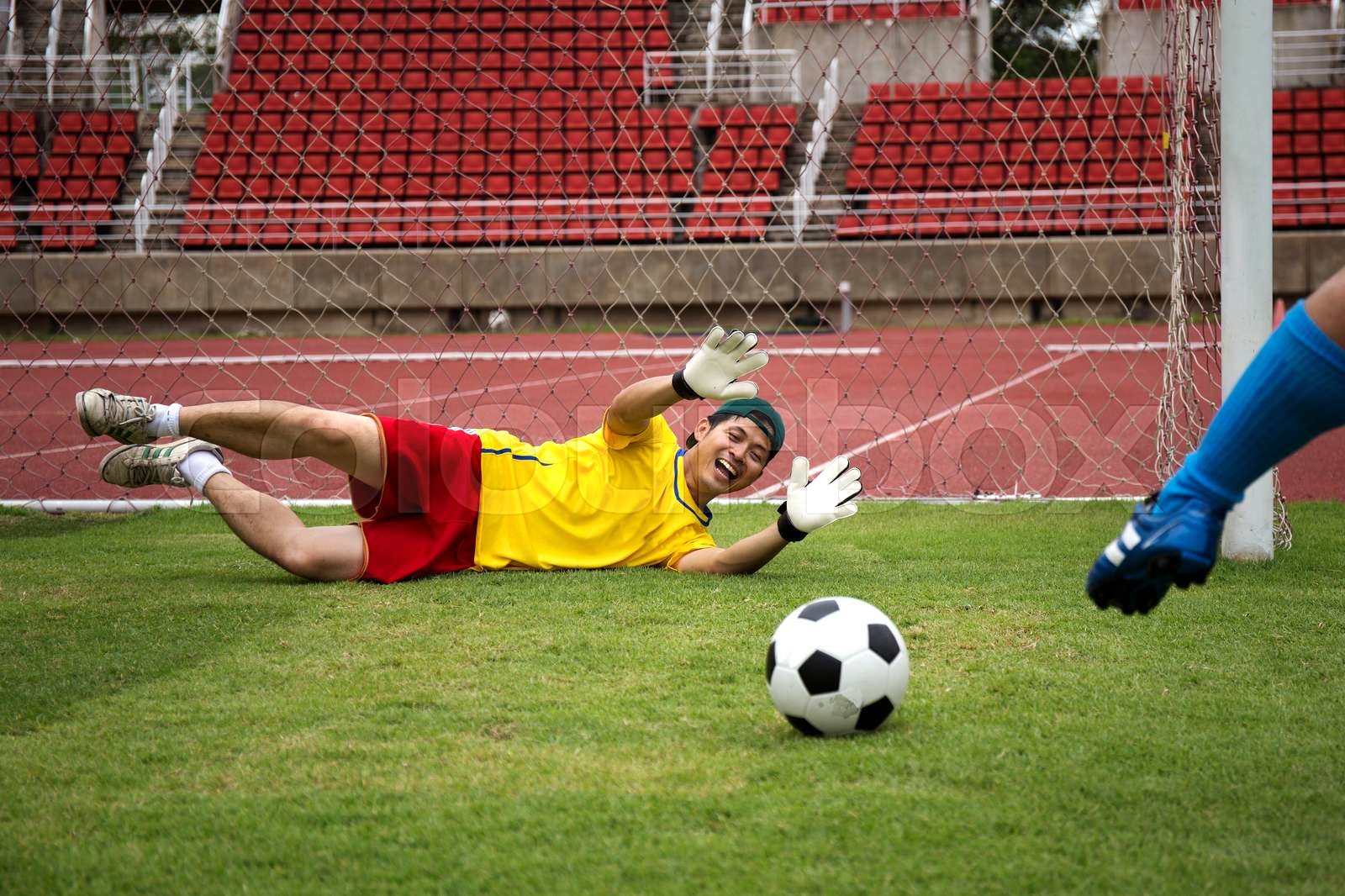 soccer player shooting the football | Stock image | Colourbox