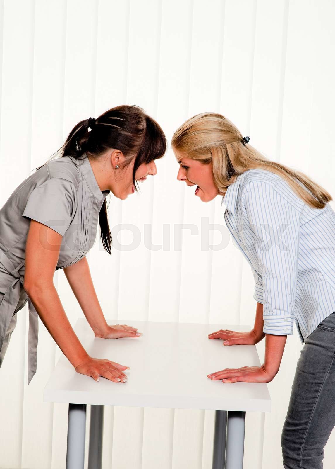 dispute among employees at work in the office | Stock image | Colourbox