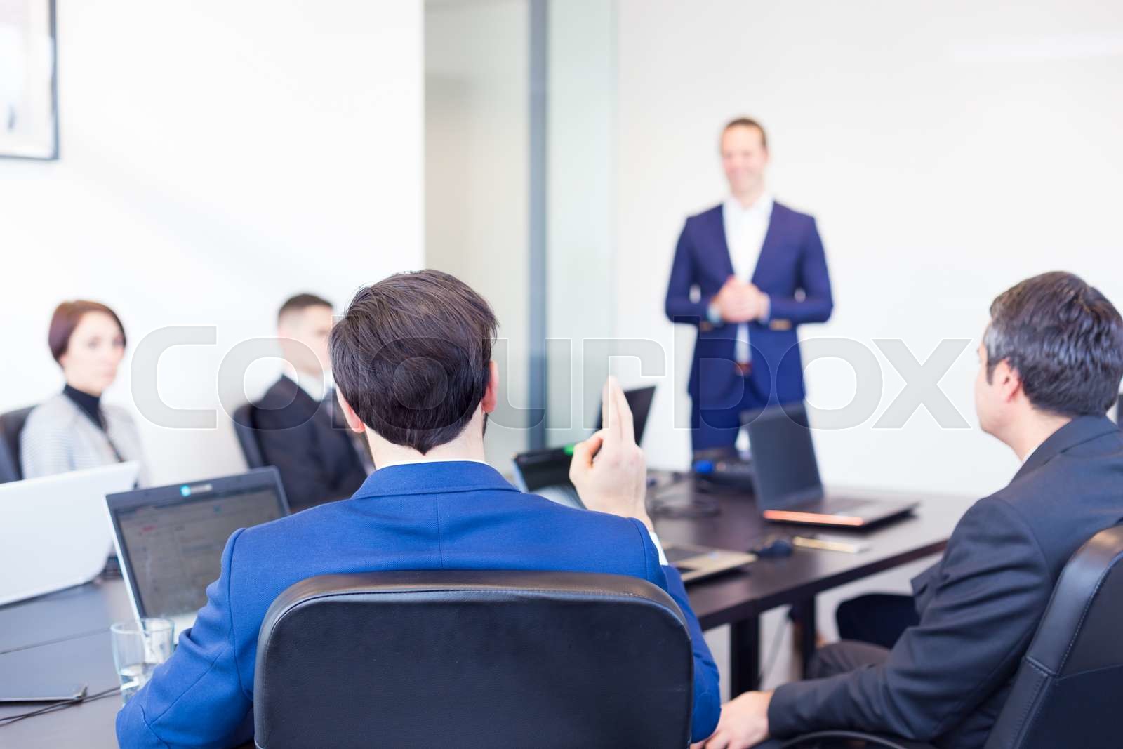 Colleague asking question to business team leader. | Stock image ...