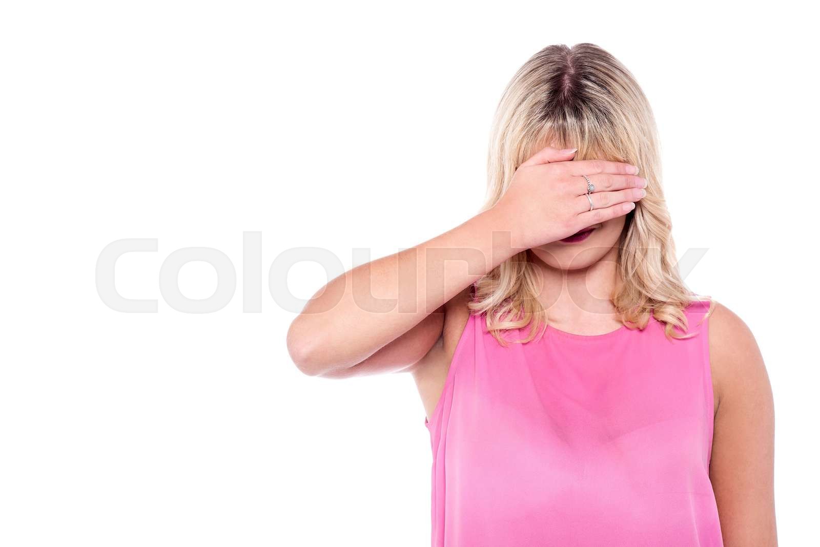 Woman hiding her face | Stock image | Colourbox