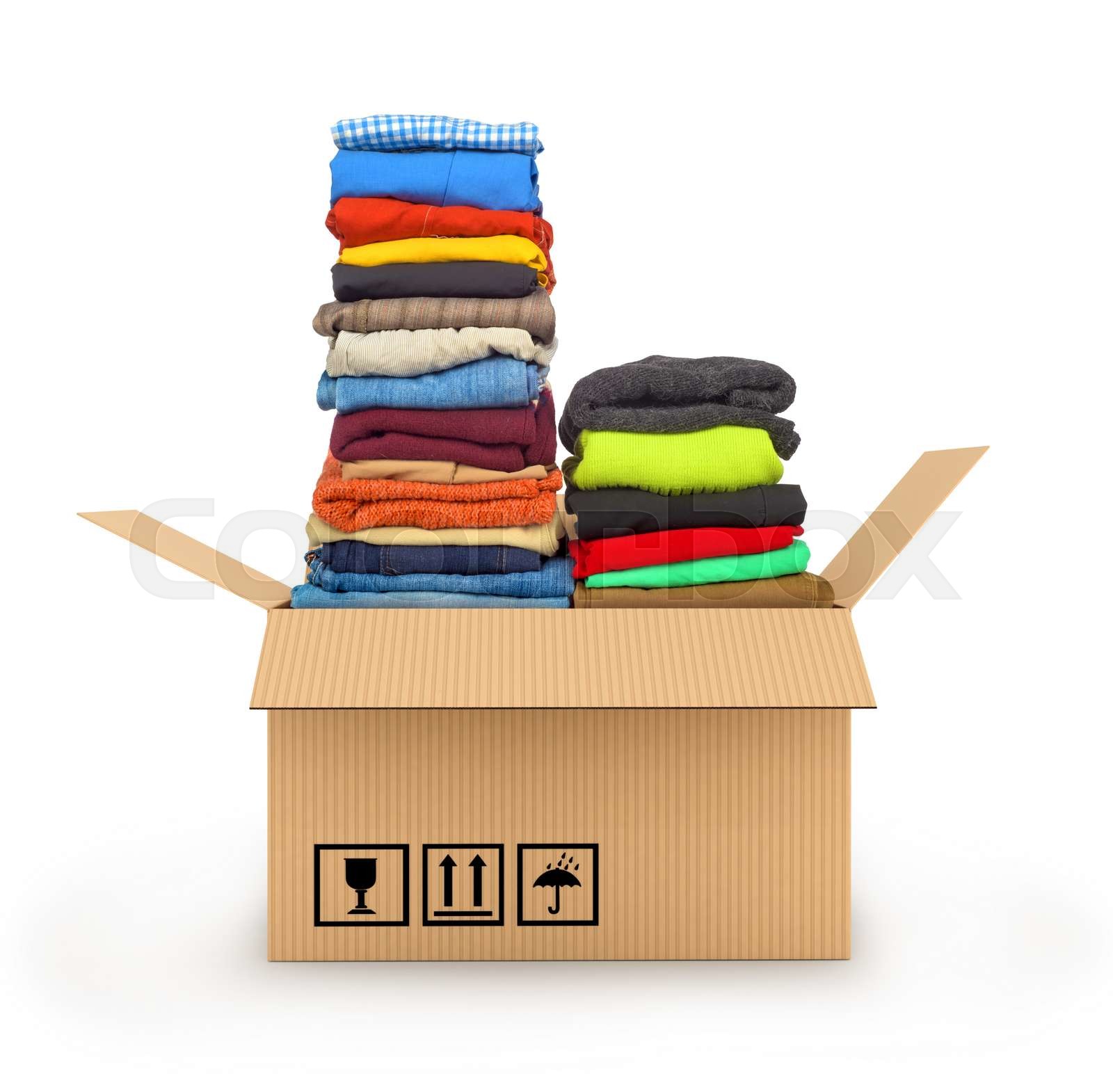 Stack of clothing in cardboard box isolated on white, delivery of ...