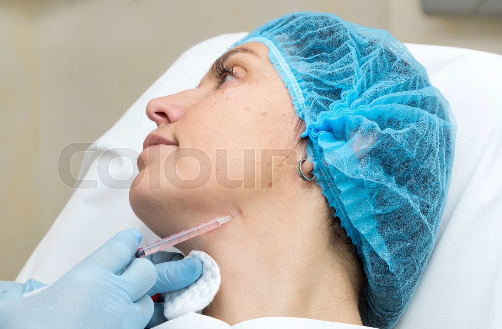 Cosmetic treatment with injection in a clinic | Stock image | Colourbox