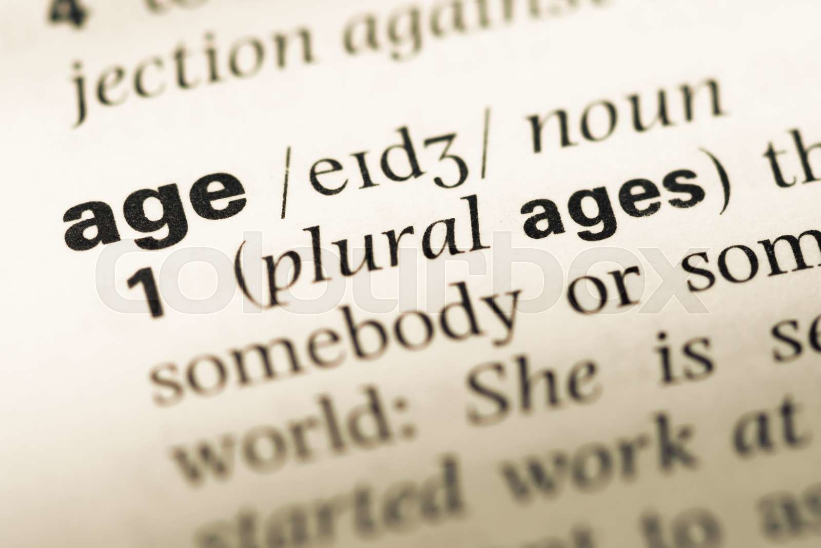 Close up of old English dictionary page with word age. | Stock image ...