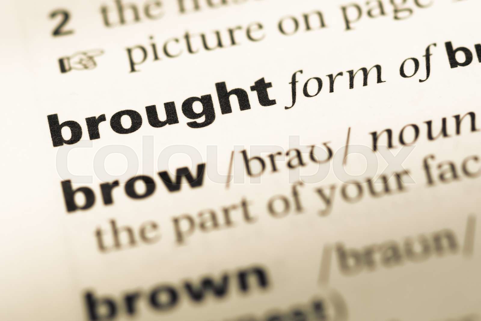 Close Up Of Old English Dictionary Page With Word Brought Stock close-up-of-old-english-dictionary-page-with-word-brought-stock