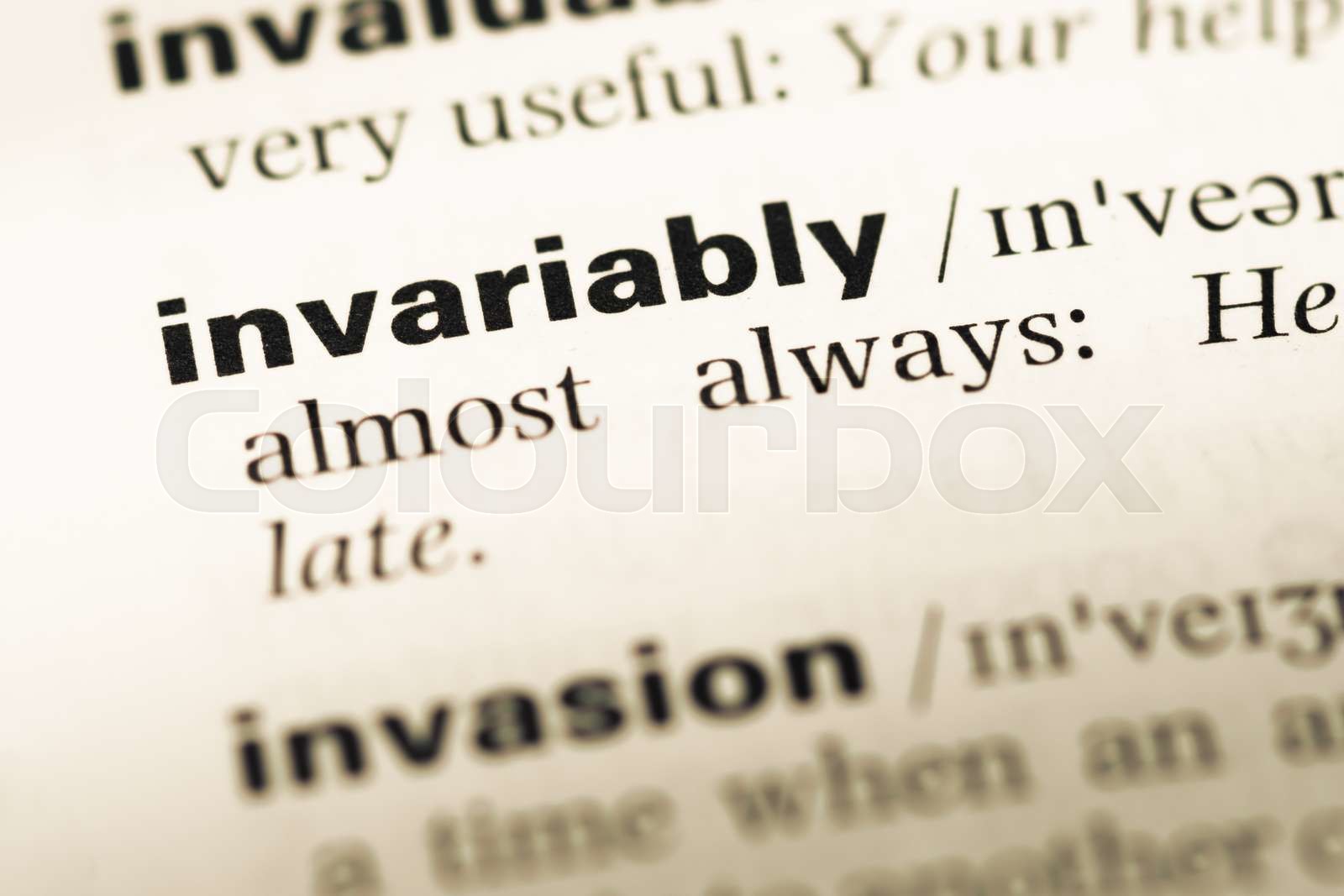 Close up of old English dictionary page with word invariably. | Stock ...