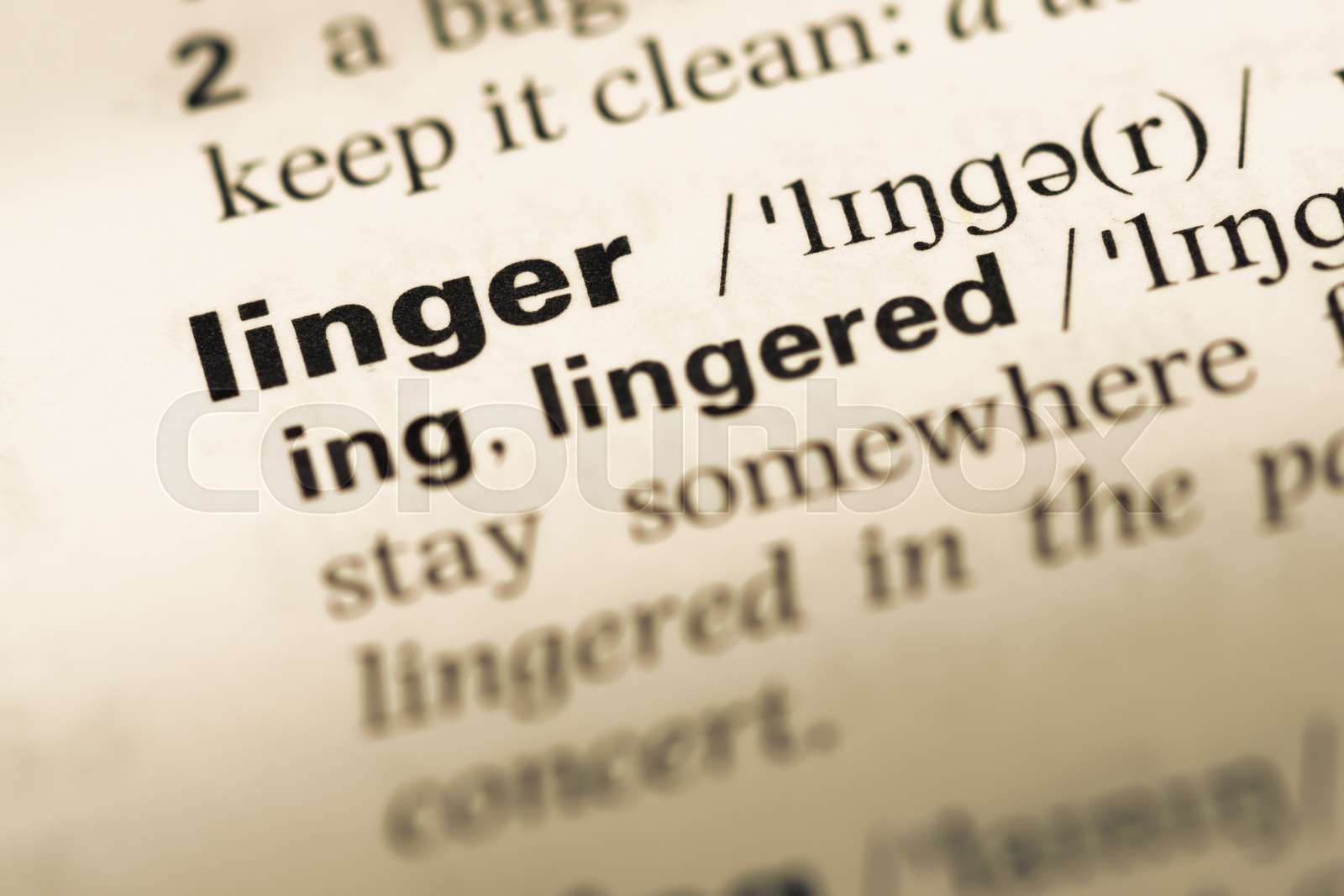 Close up of old English dictionary page with word linger. | Stock image ...