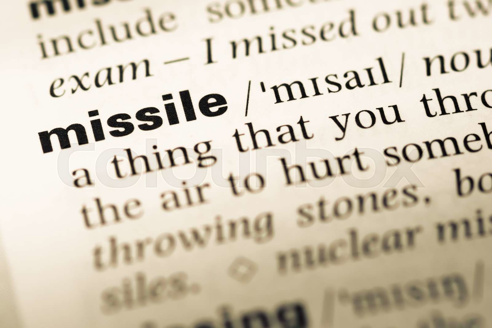 Close up of old English dictionary page with word missile. | Stock ...