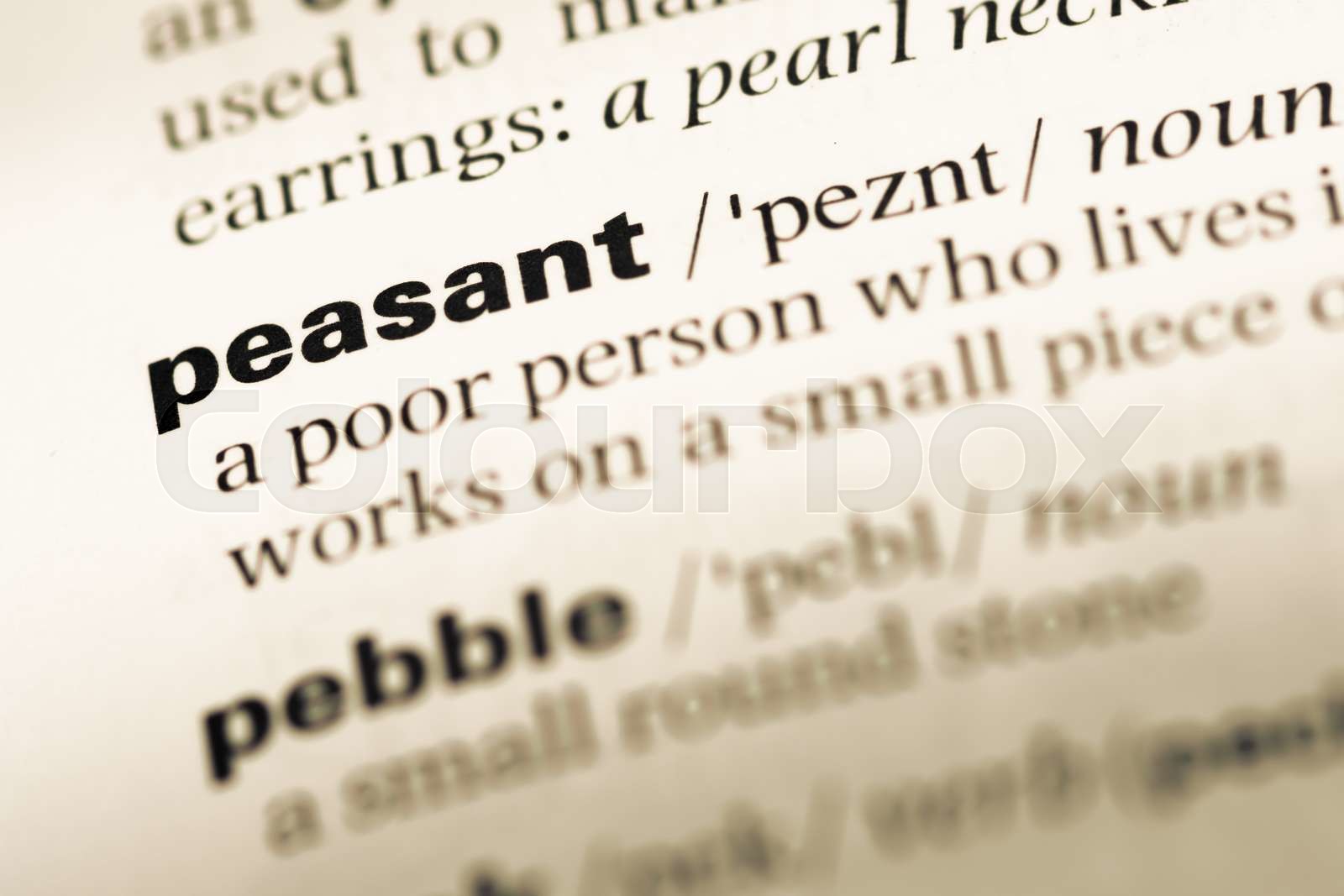 Close up of old English dictionary page with word peasant. | Stock ...