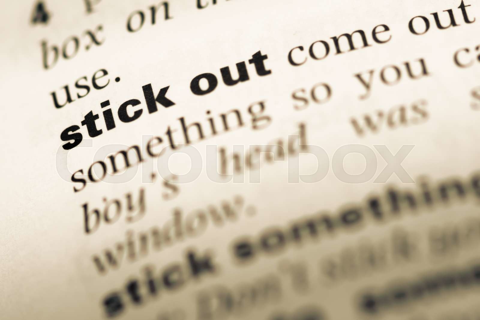 Close up of old English dictionary page with word stick out. | Stock ...