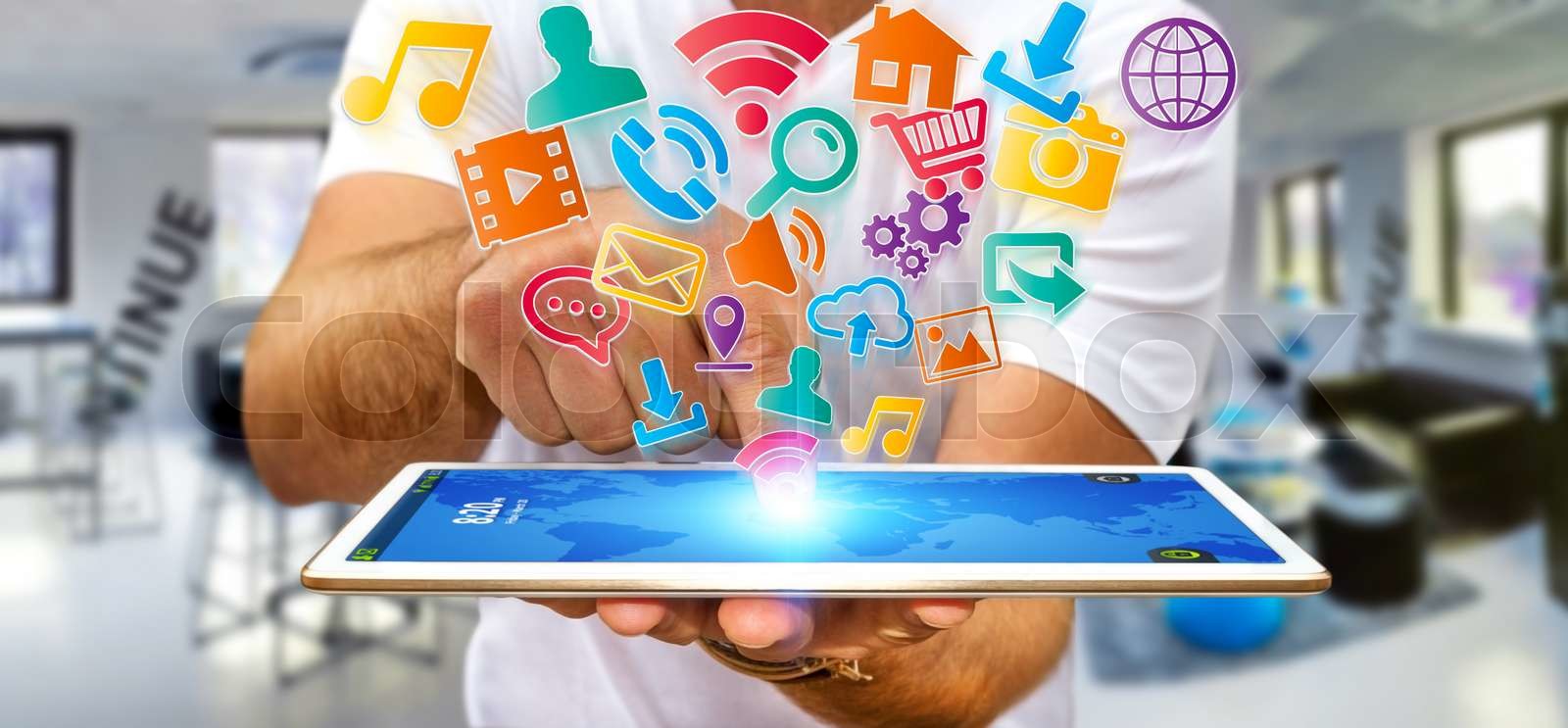 Businessman using modern digital icon application on his tablet | Stock ...