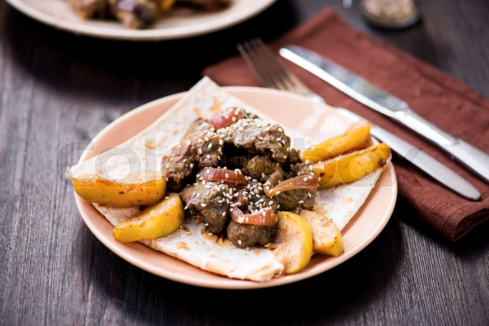Stir-fried chicken kidney with apples | Stock image | Colourbox