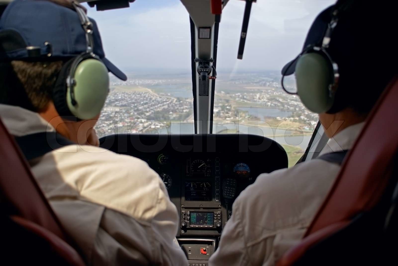Pilots in helicopter cabin | Stock image | Colourbox