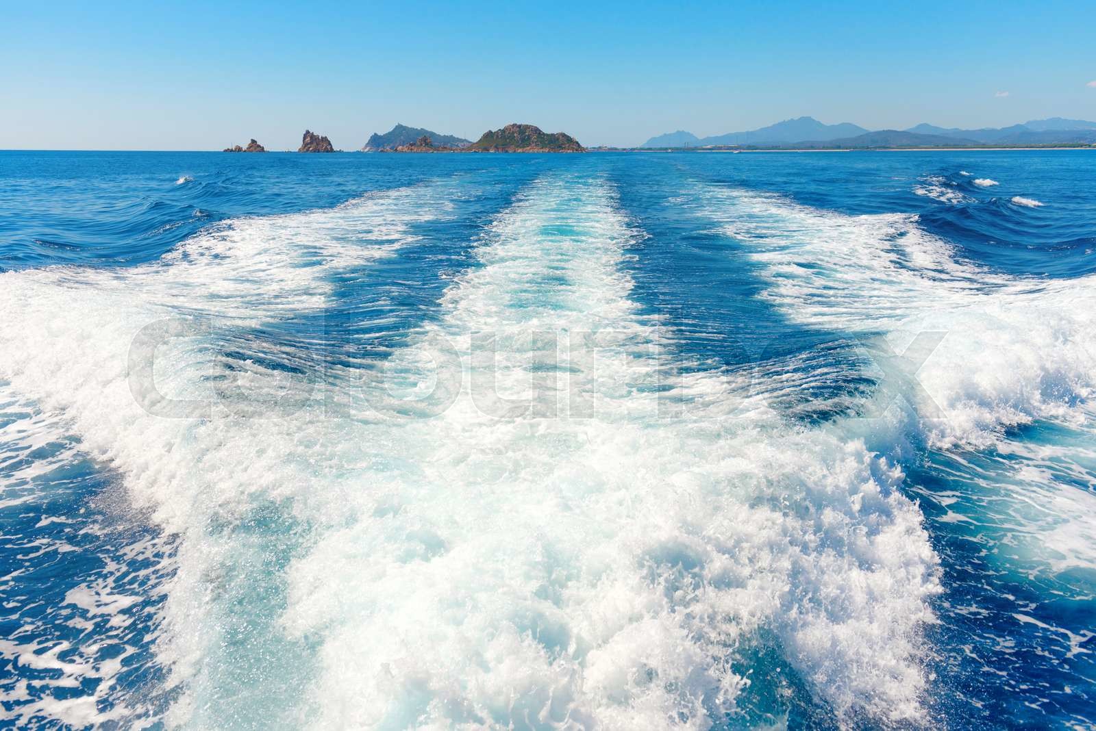 Waves on blue sea behind the boat | Stock image | Colourbox