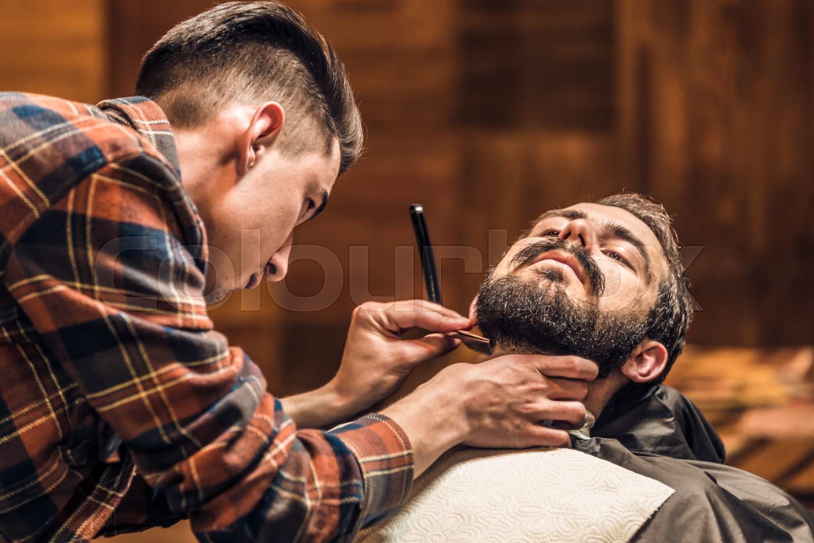 Shaving process of beards in Barbershop | Stock image | Colourbox