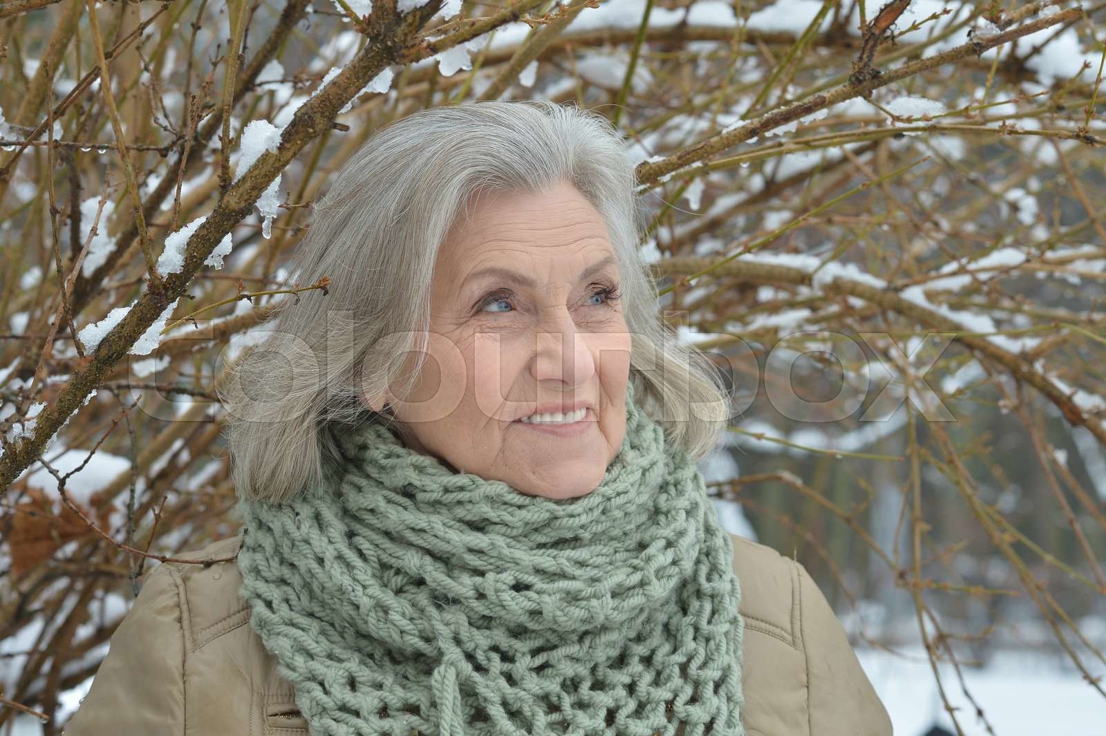 Old woman in the winter | Stock image | Colourbox
