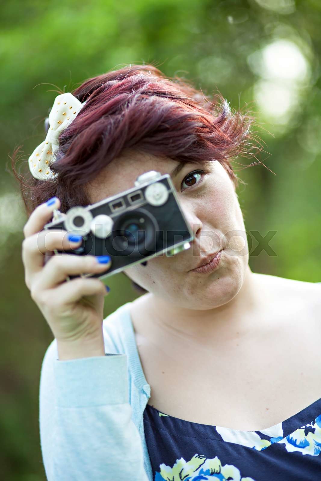 Woman Snapping a Photo | Stock image | Colourbox