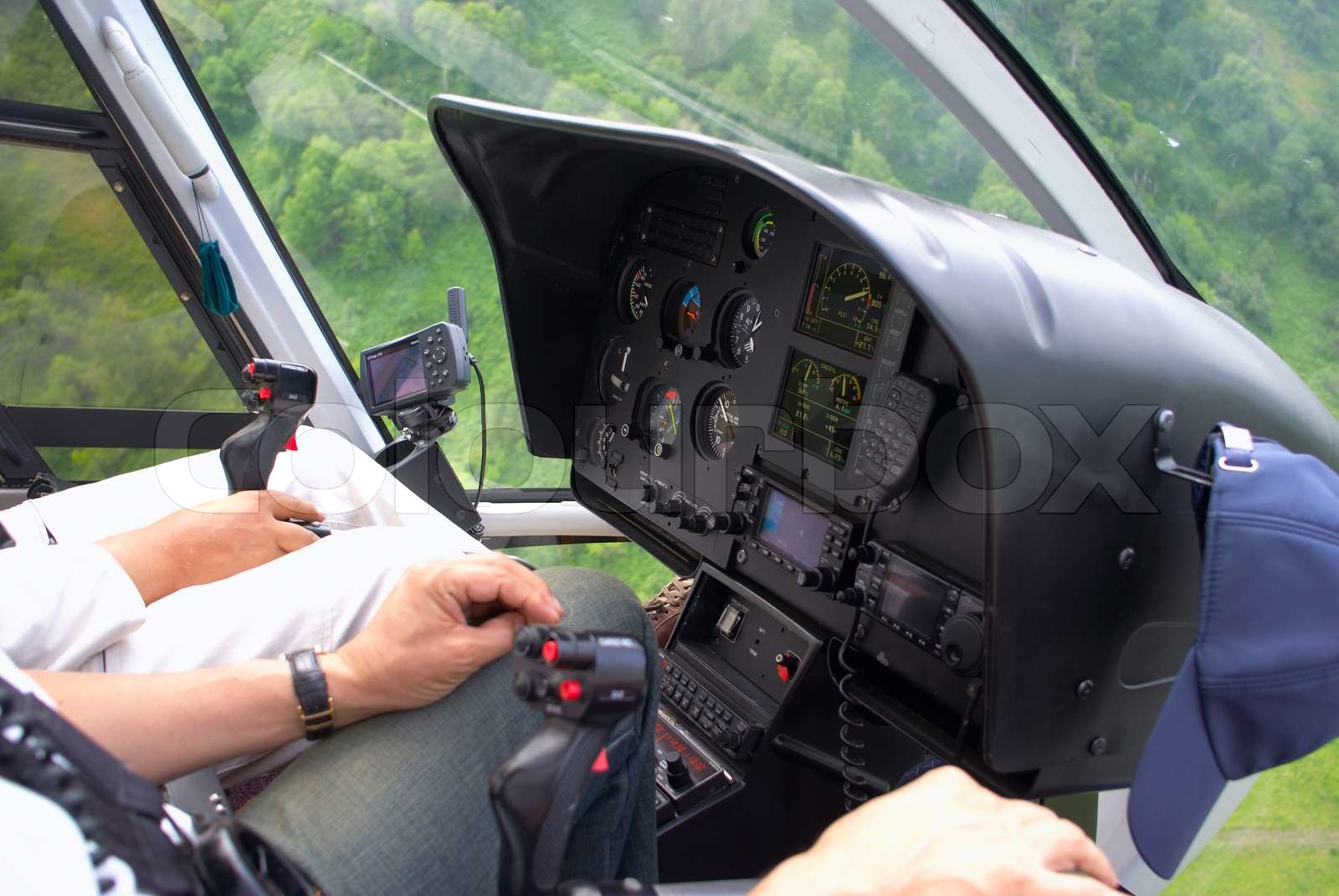 Pilots in helicopter cabin | Stock image | Colourbox