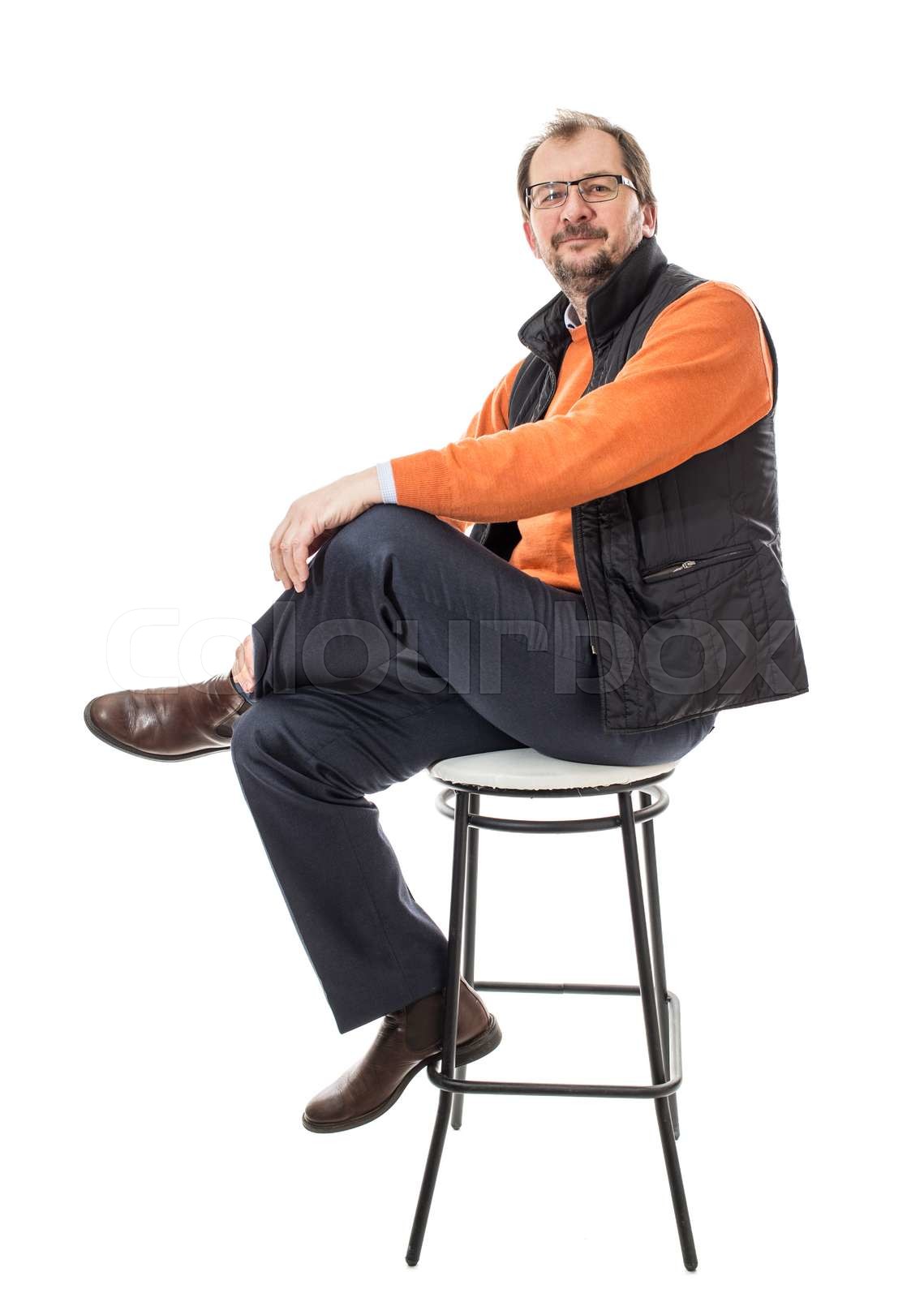 Confident male model with crossed legs. | Stock image | Colourbox
