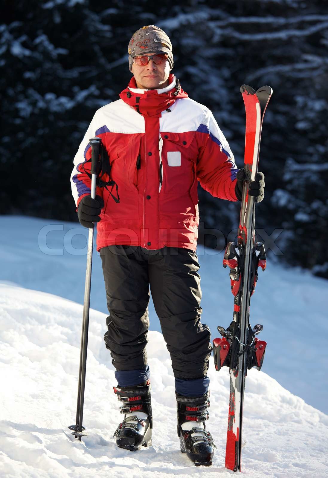 Skier portrait on ski resort and snowfall | Stock image | Colourbox