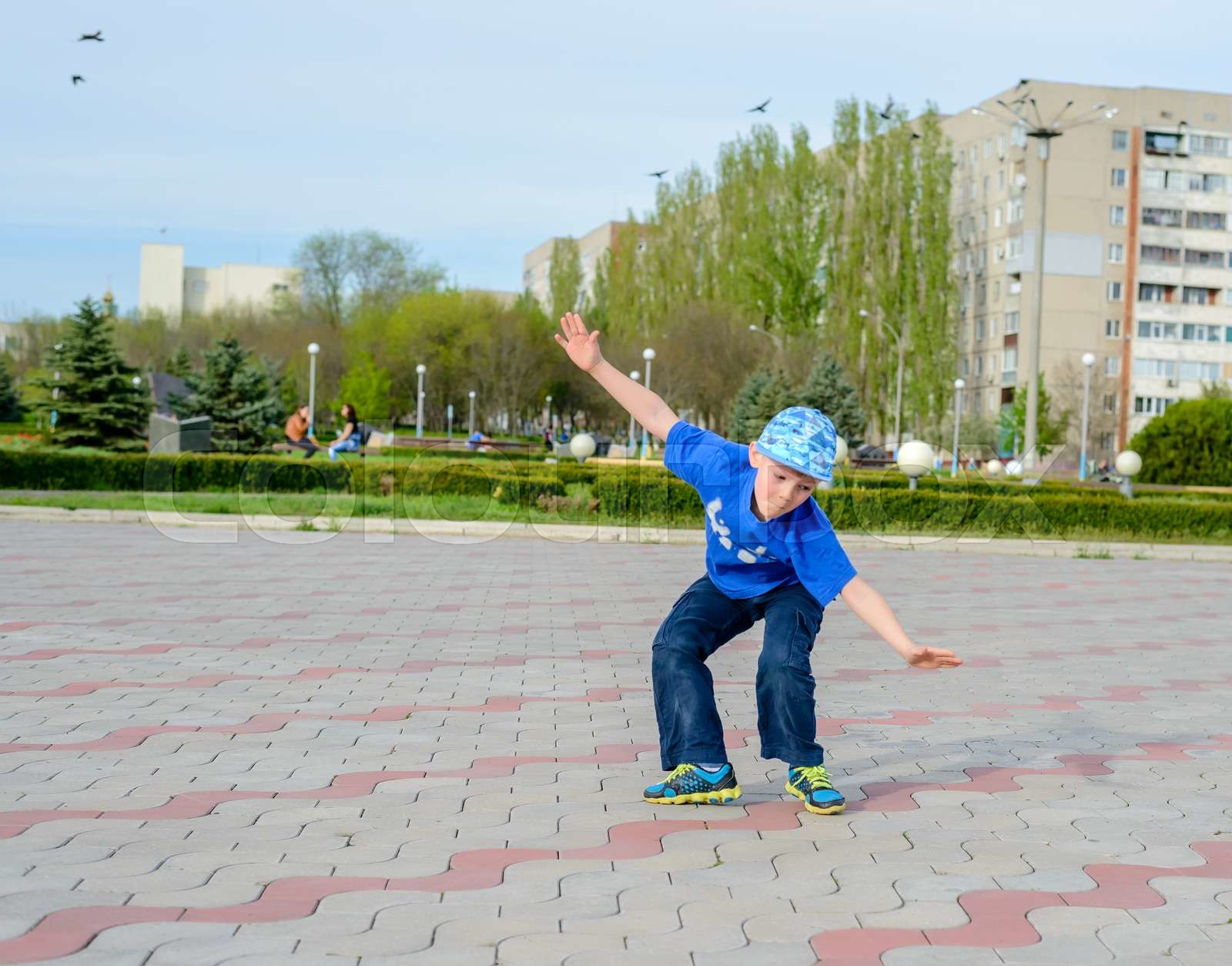 Agile young boy doing cartwheels | Stock image | Colourbox