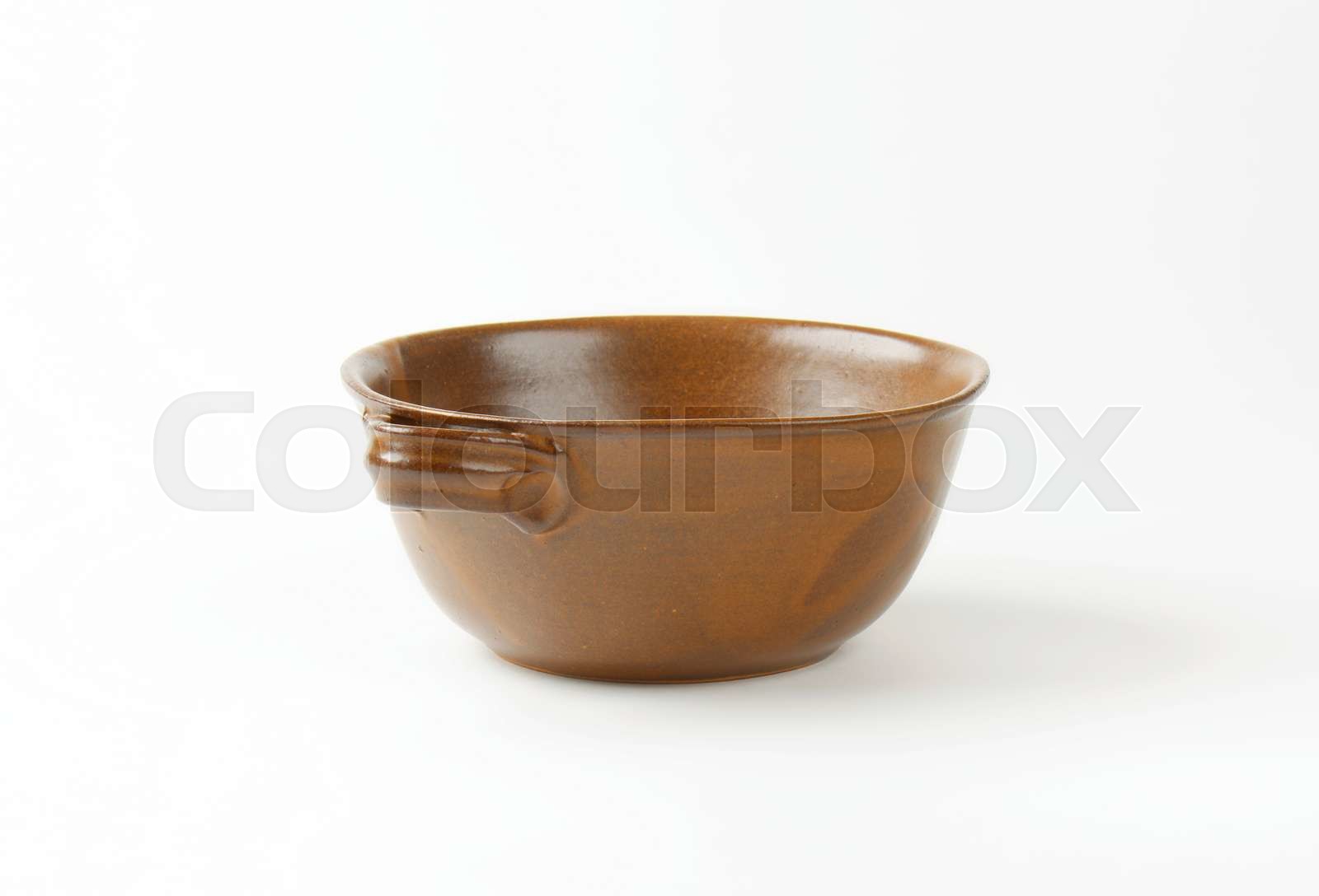 Deep pottery double handle dish | Stock image | Colourbox
