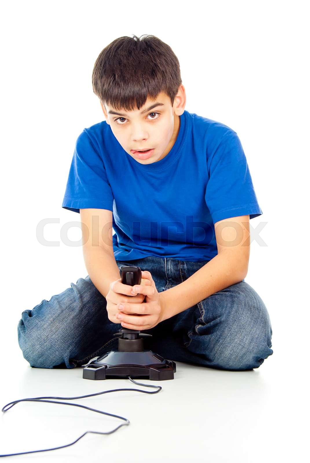 guy playing video games sitting | Stock image | Colourbox