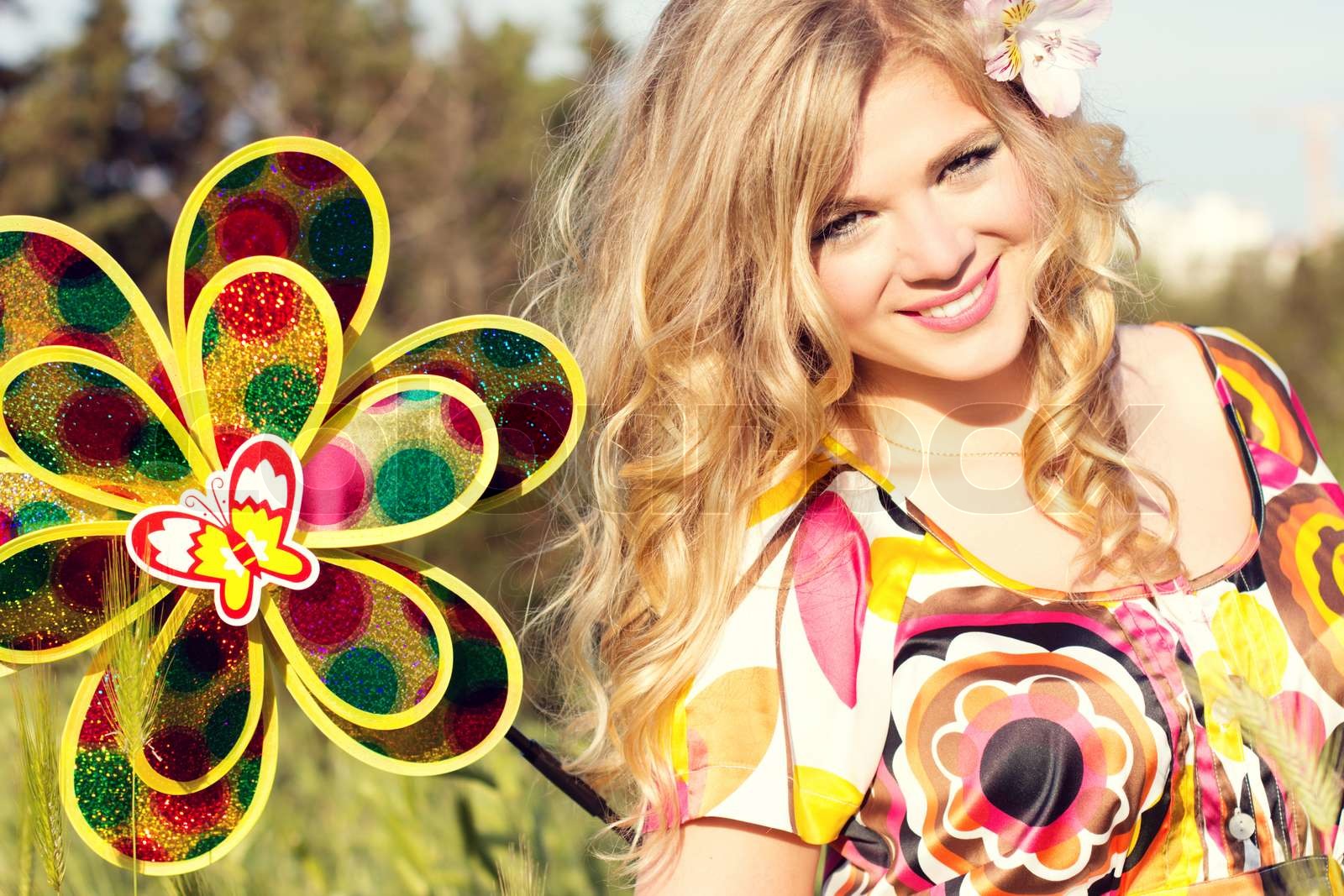 Pinwheel - girl with colored pinwheel | Stock image | Colourbox