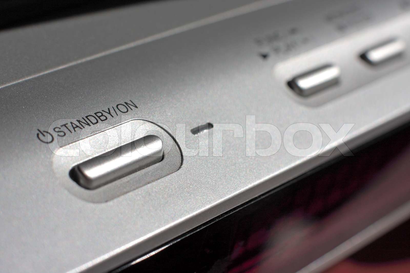 Macro shot of DVD player standby/on button | Stock image | Colourbox