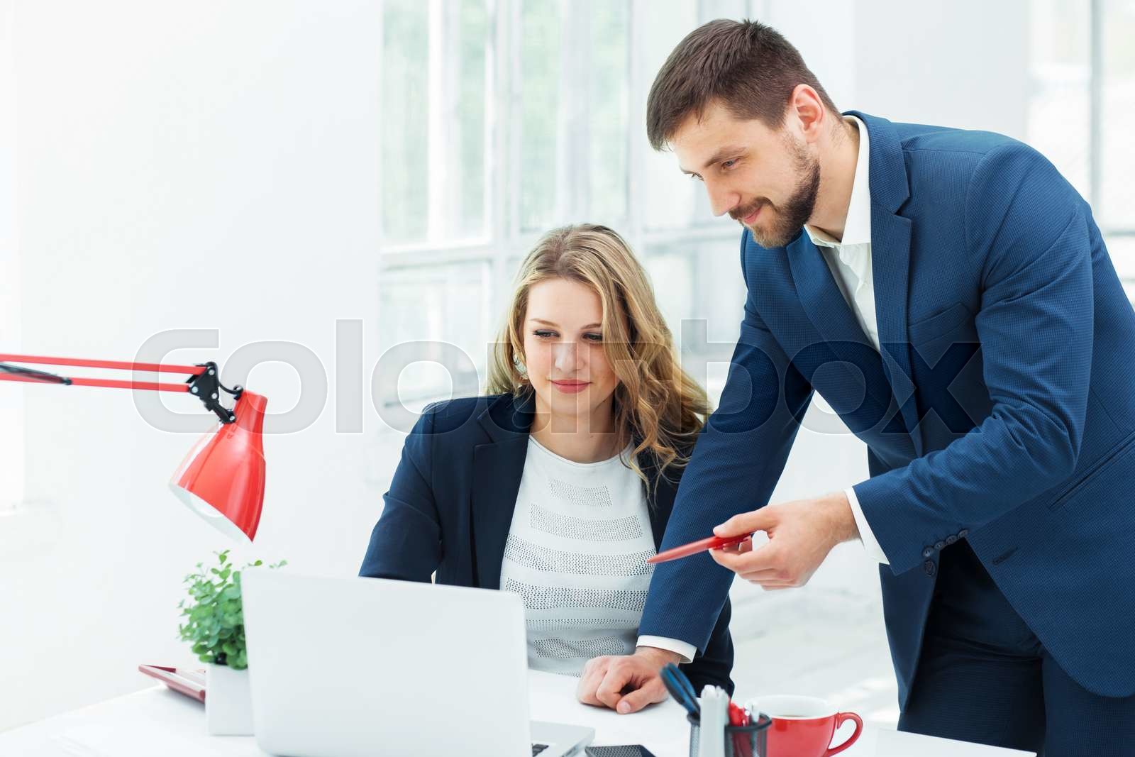 Male and female office workers. | Stock image | Colourbox
