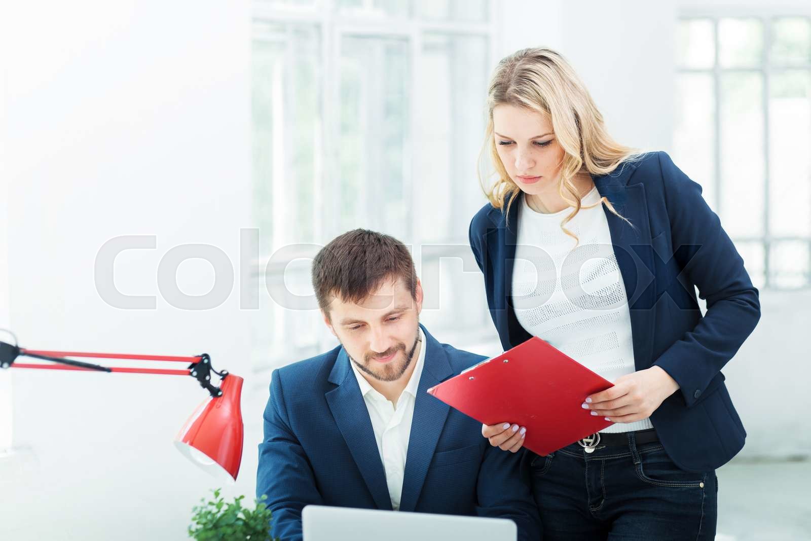 Male and female office workers. | Stock image | Colourbox