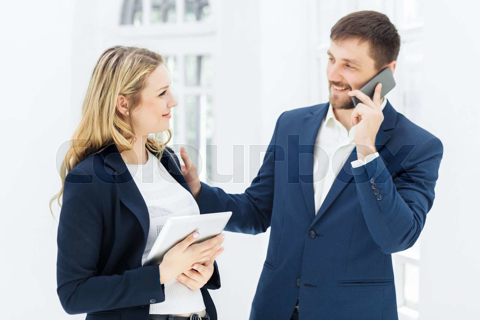 Male and female office workers. | Stock image | Colourbox