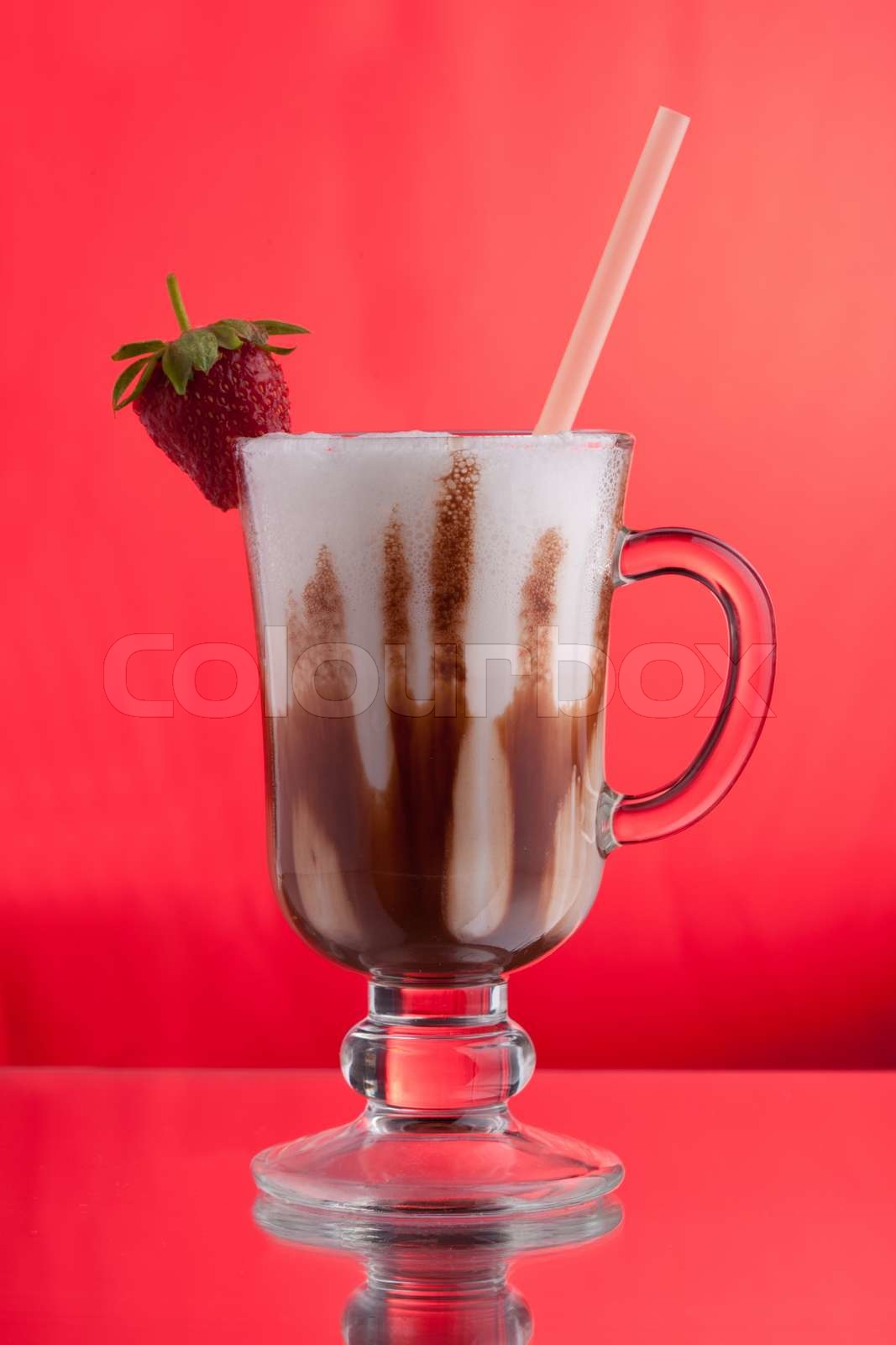 Strawberry milkshake with straw and chocolate on red | Stock image ...
