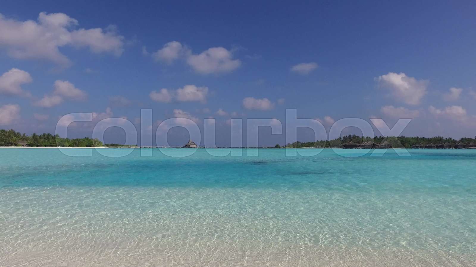 blue sea lagoon on maldives beach | Stock video | Colourbox