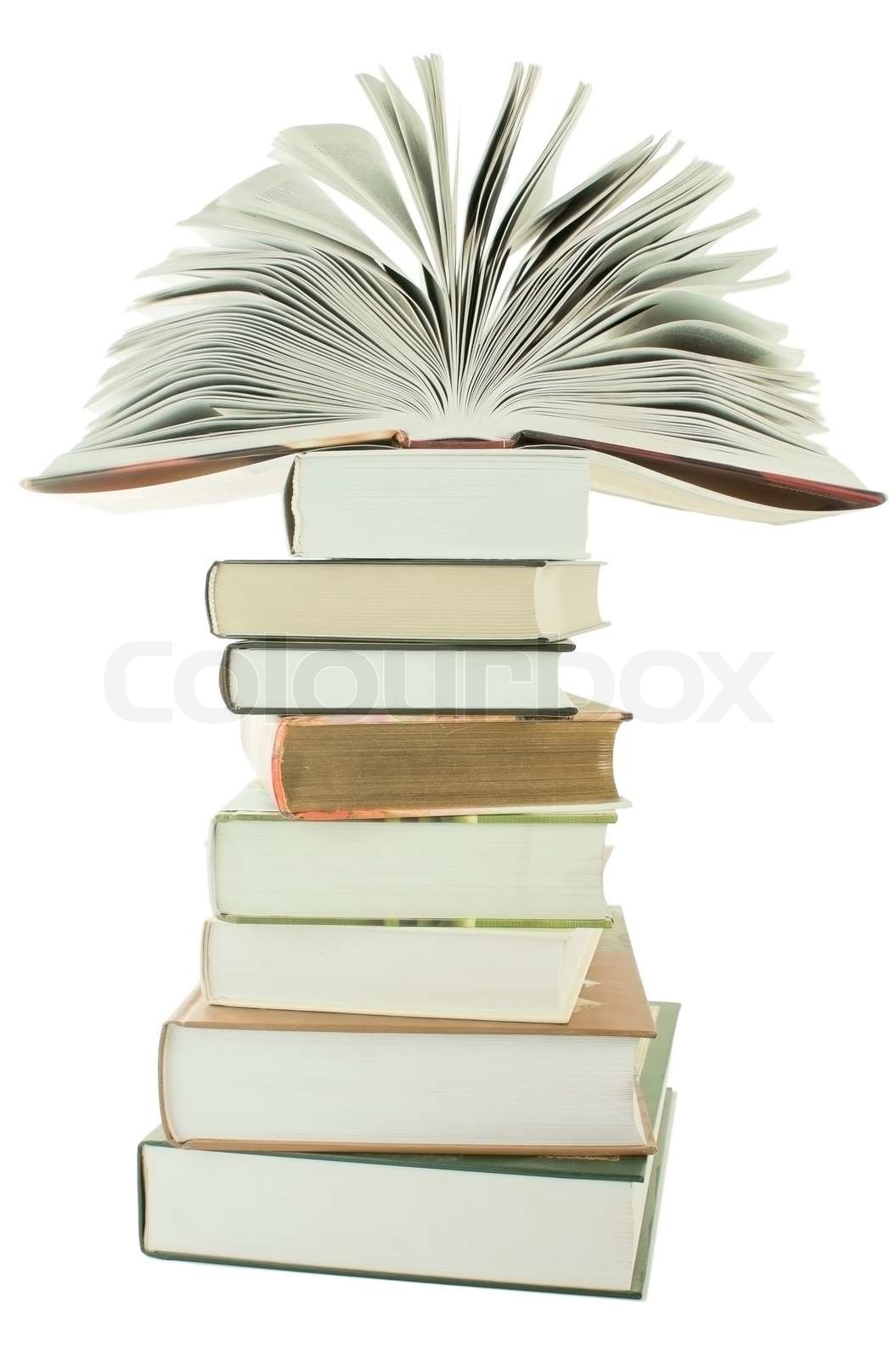 Open book on the stack of books isolated on white | Stock image | Colourbox