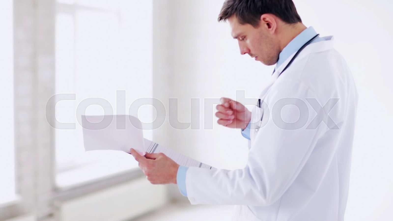 male doctor making a prescription | Stock video | Colourbox