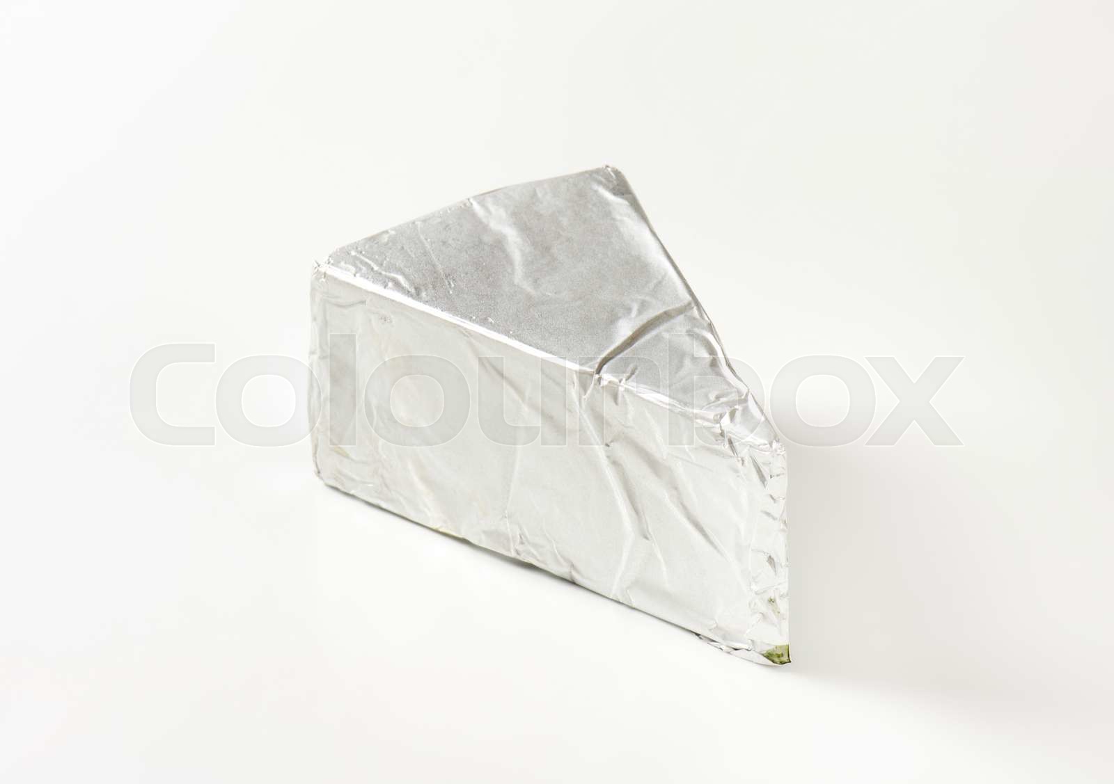Foil wrapped cheese | Stock image | Colourbox