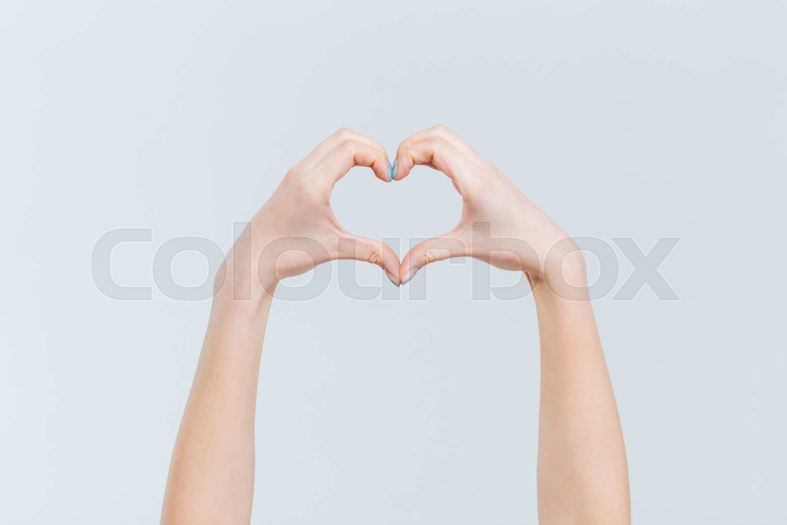 Female hands showing heart gesture with fingers | Stock image | Colourbox