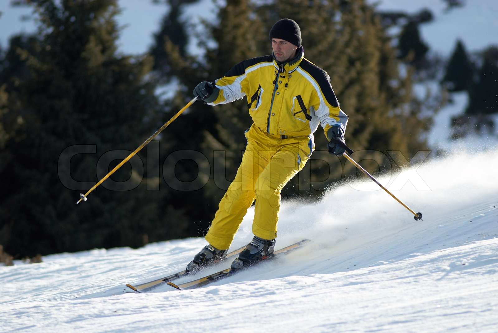 Yellow skier on ski slope | Stock image | Colourbox