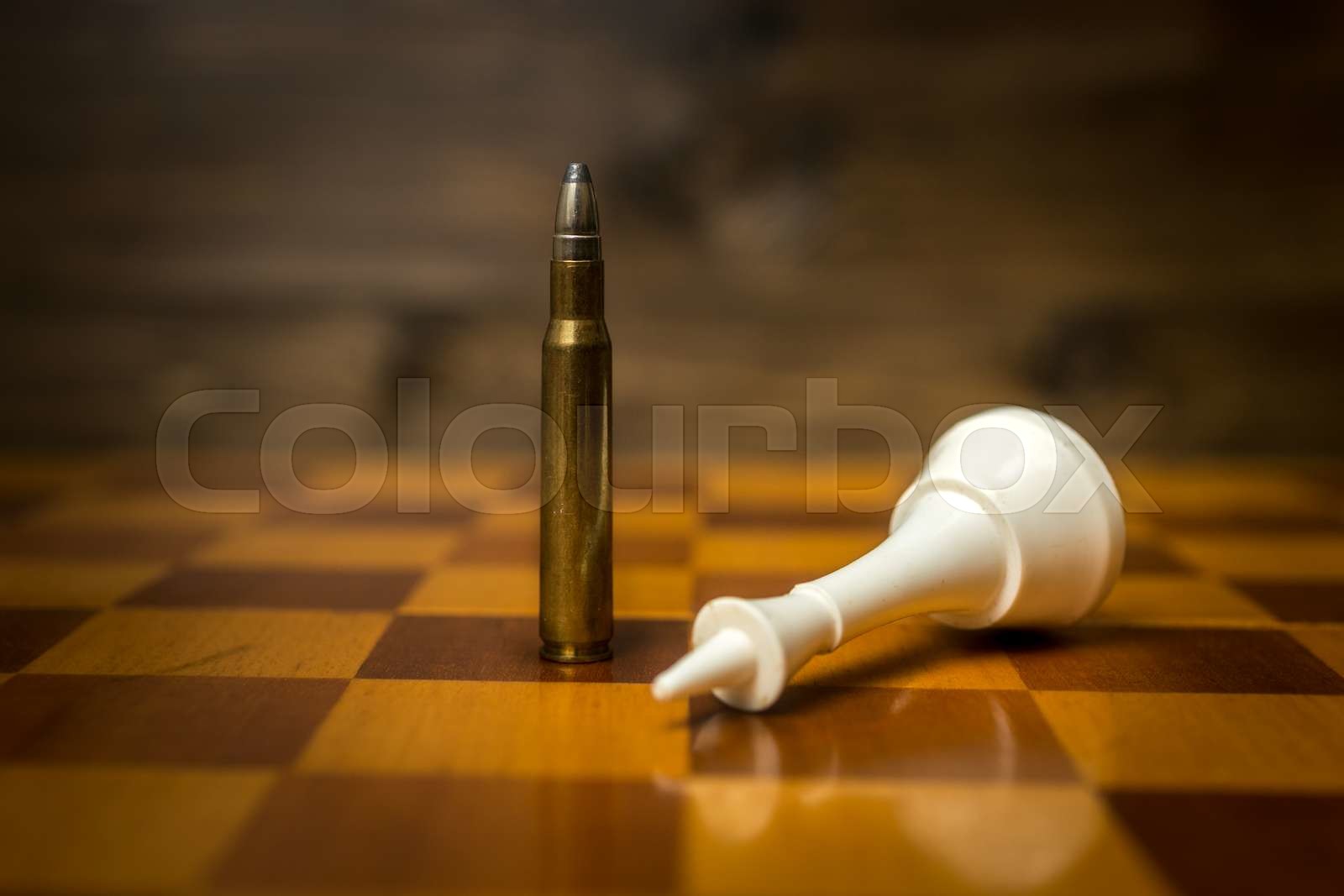 Closeup of bullet wins chess game. Concept of gun power | Stock image ...