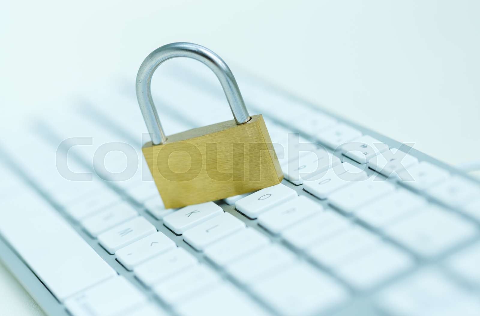 Security lock on white computer keyboard | Stock image | Colourbox