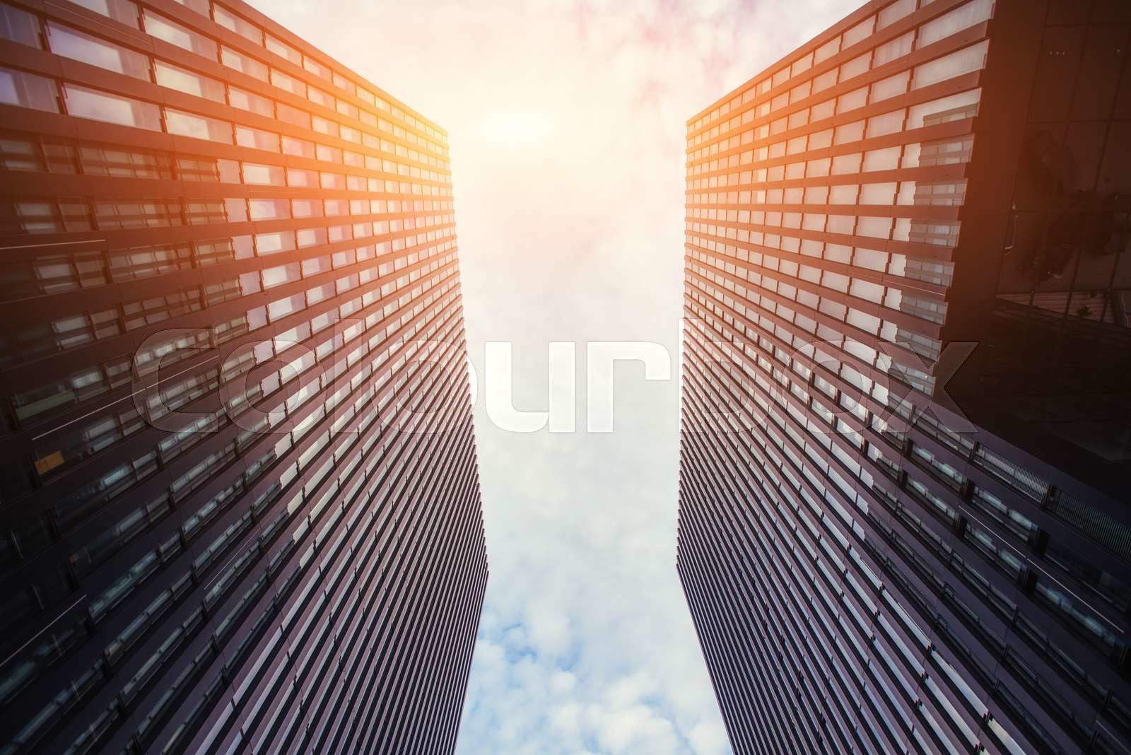 High-rise building in the sky through sun rays | Stock image | Colourbox