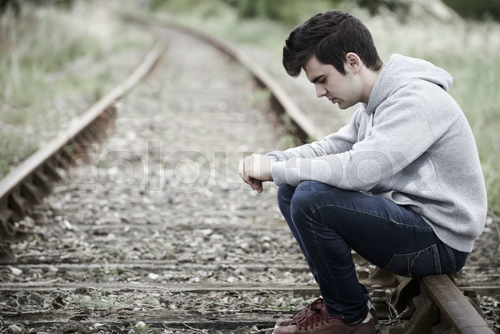 Sad Boy In Railway Track