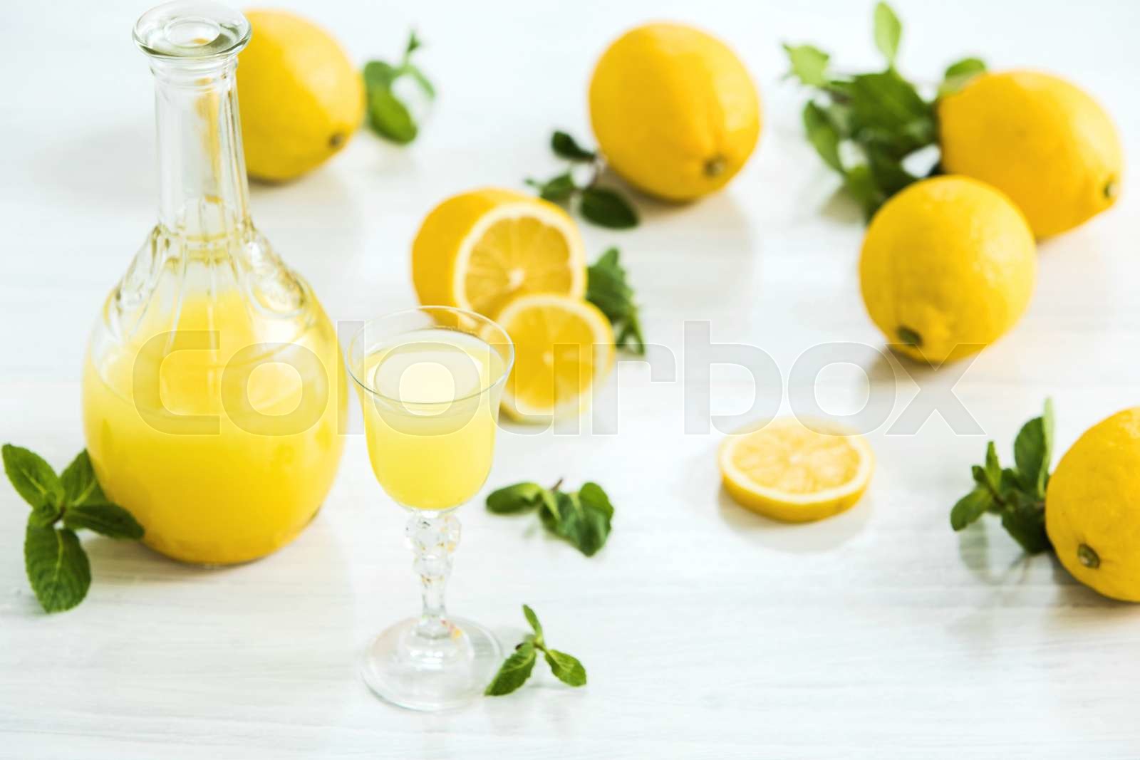 Italian traditional liqueur limoncello with lemon | Stock image | Colourbox