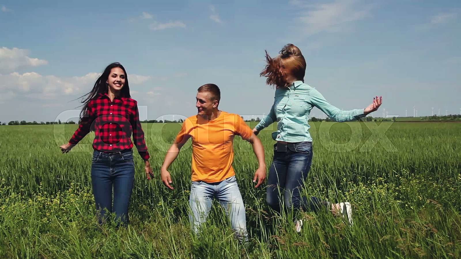 Friends jumping together. | Stock video | Colourbox