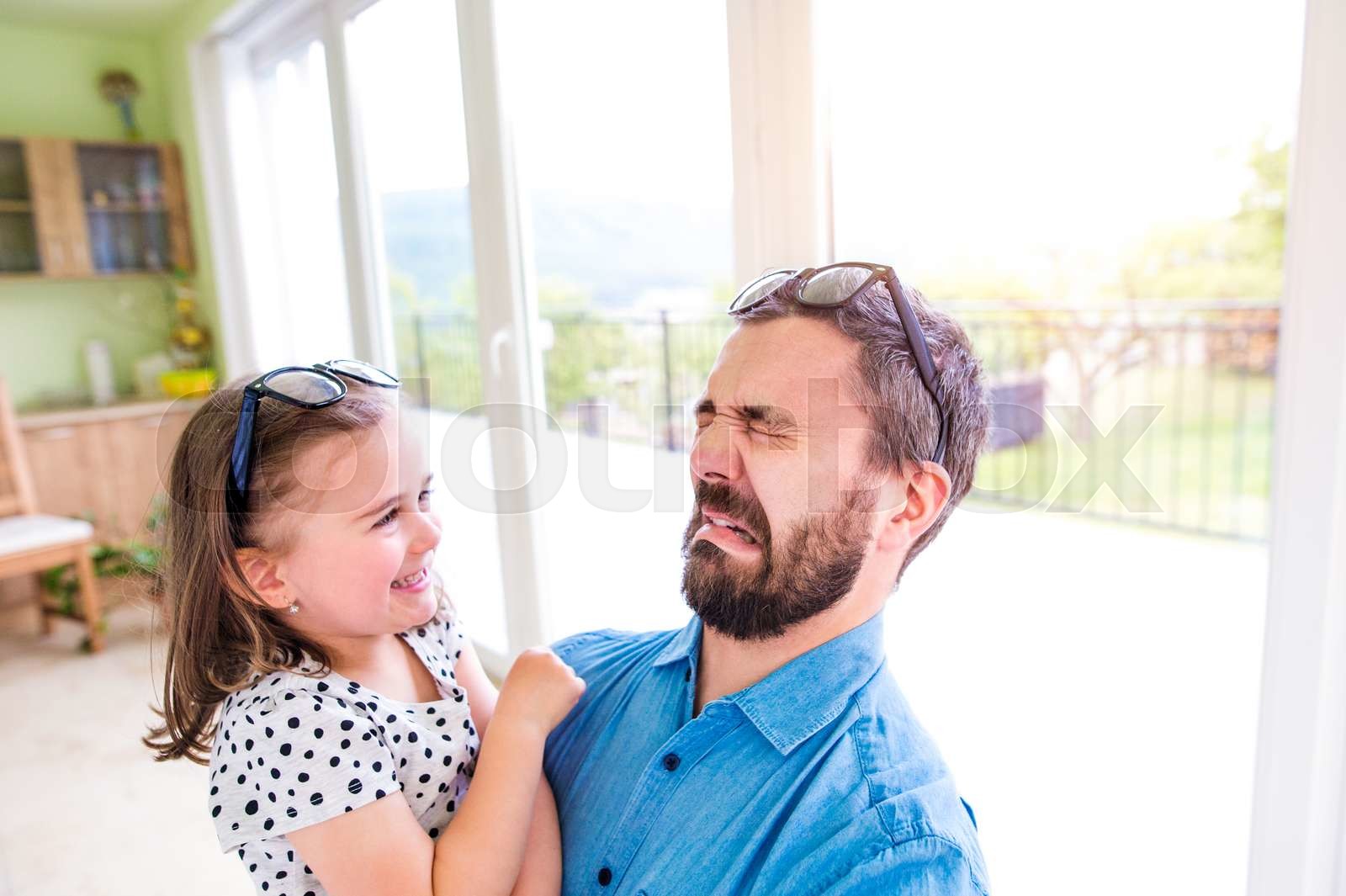 Father with his little daughter making funny face | Stock image | Colourbox