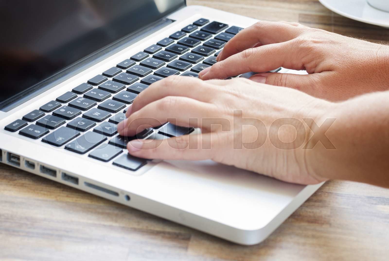 hands on laptop keyboard | Stock image | Colourbox
