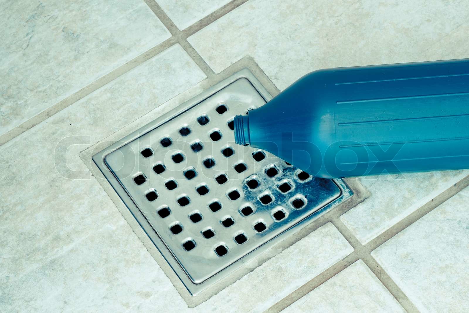 Toxic waste running down the drain | Stock image | Colourbox